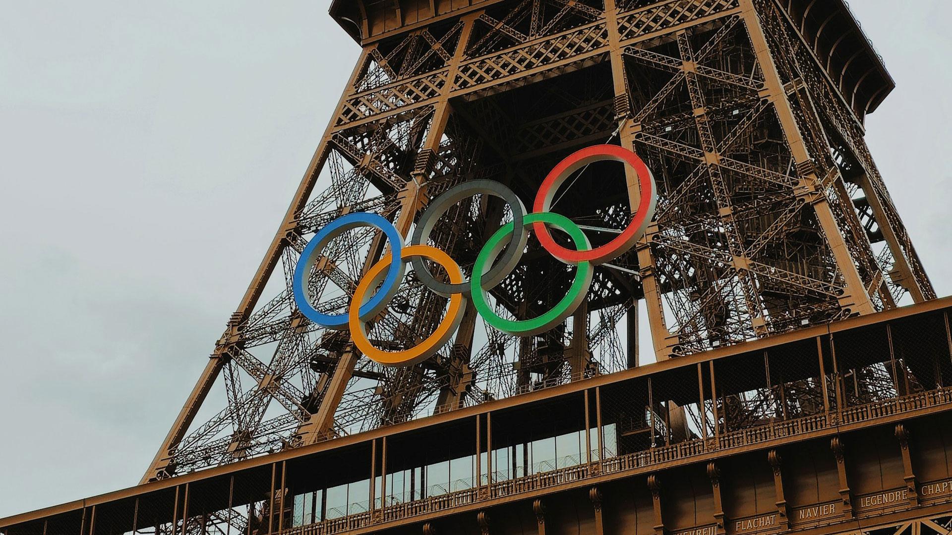 Gekleurde ringen Olympische Spelen: bedenker en betekenis